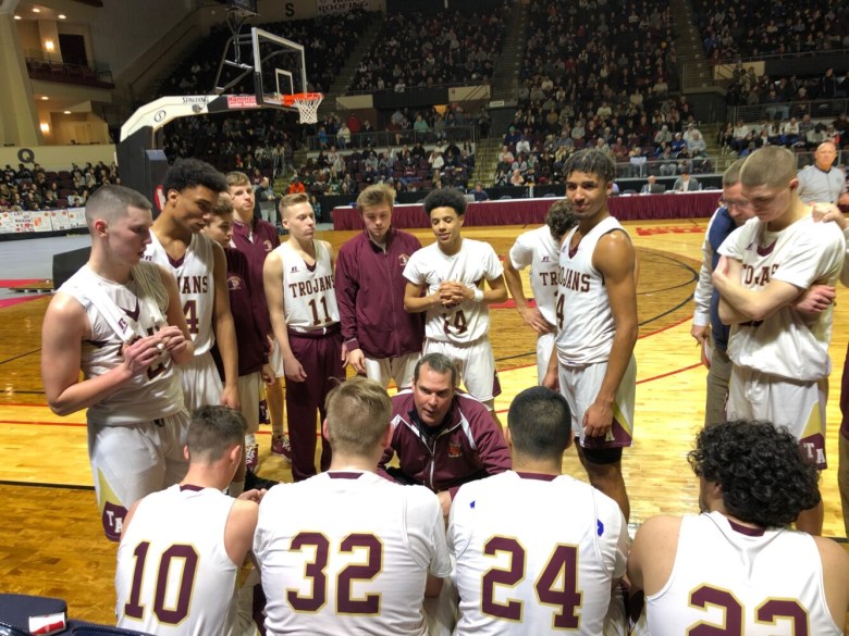 Boys’ basketball: Riots, Trojans advance to Class AA South final