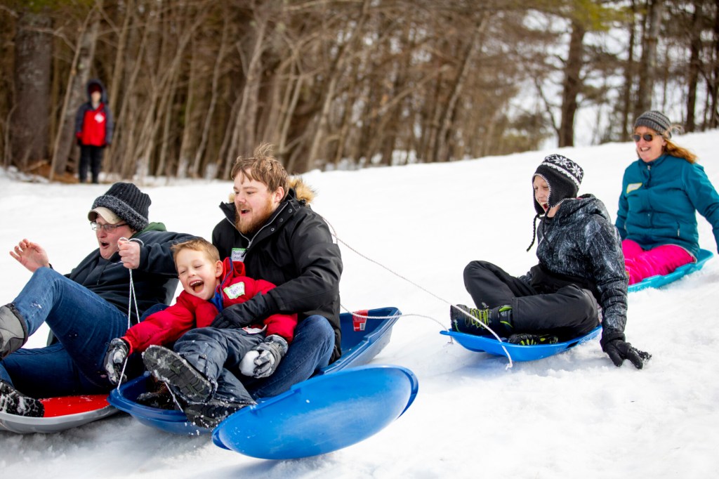 Pastor Mace and his wife, Kortney, host a sledding party