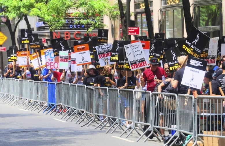 Movie and TV stars join picket lines in fight over the future of Hollywood