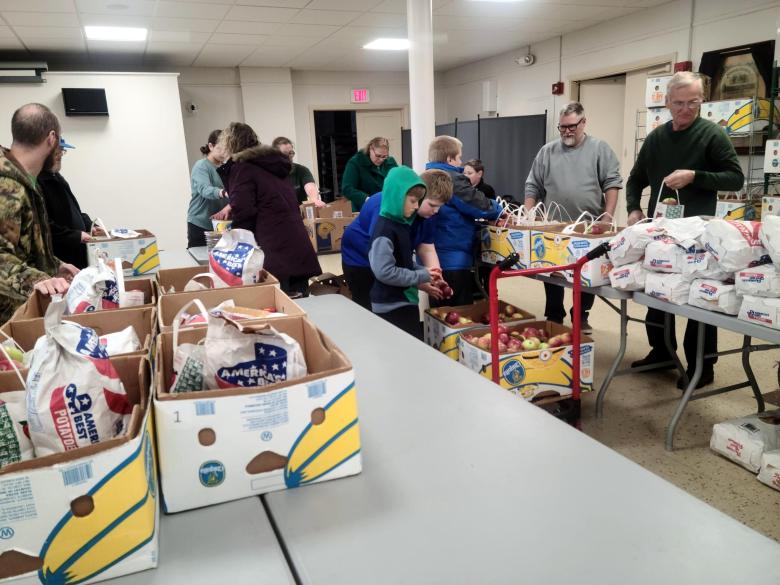 Many hands make fast work of Thanksgiving boxes assembly