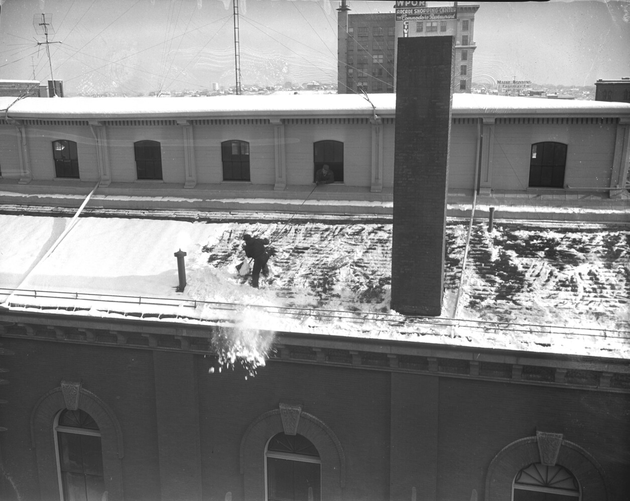 Historical photos from the 1950s show a snow-covered Portland